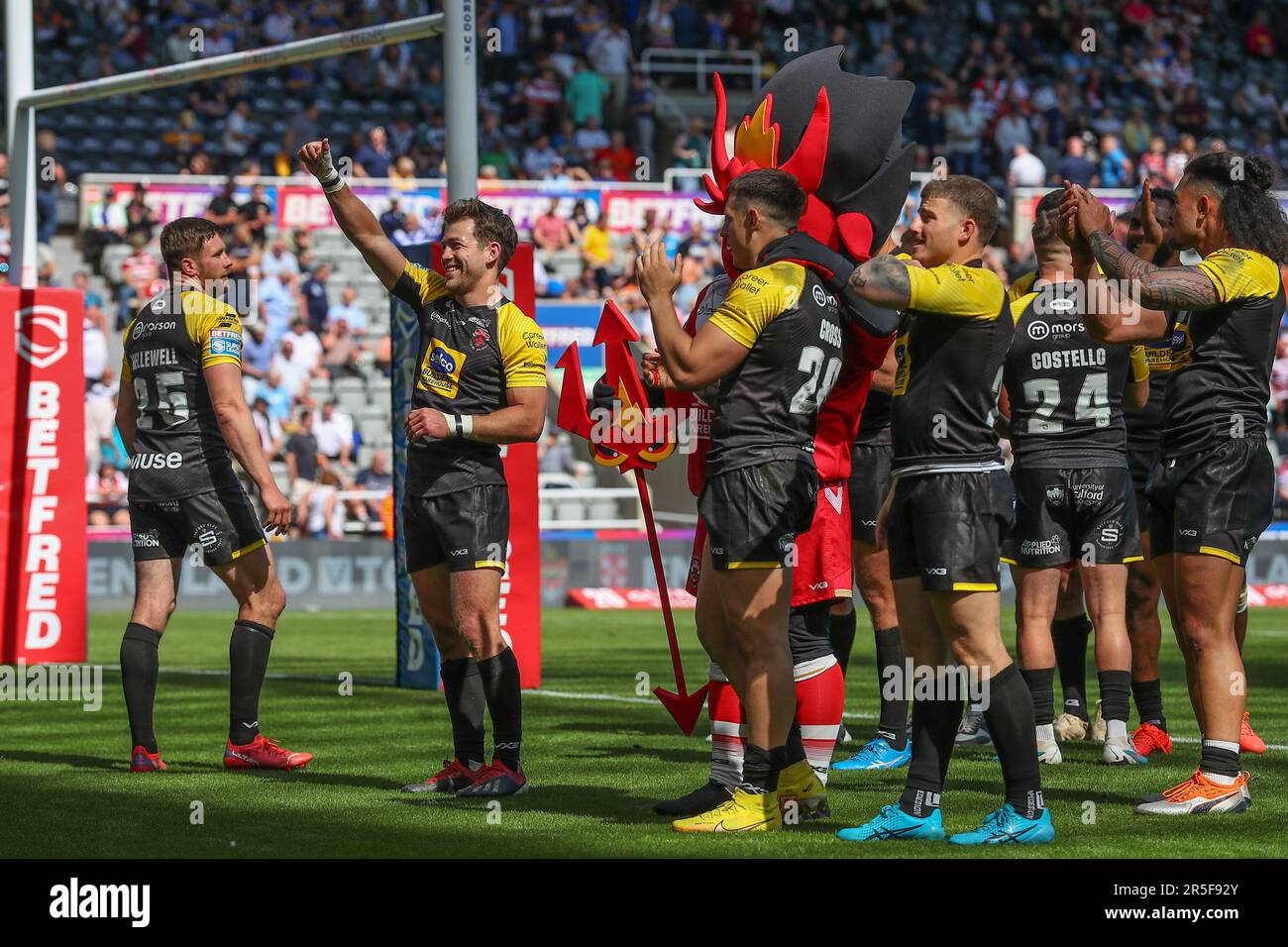Salford Red Devils players celebrate their teams win after the Betfred ...