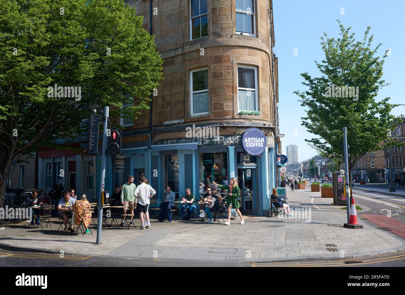 Edinburgh Scotland, UK 03 June 2023. People sit outside a cafe on Leith ...