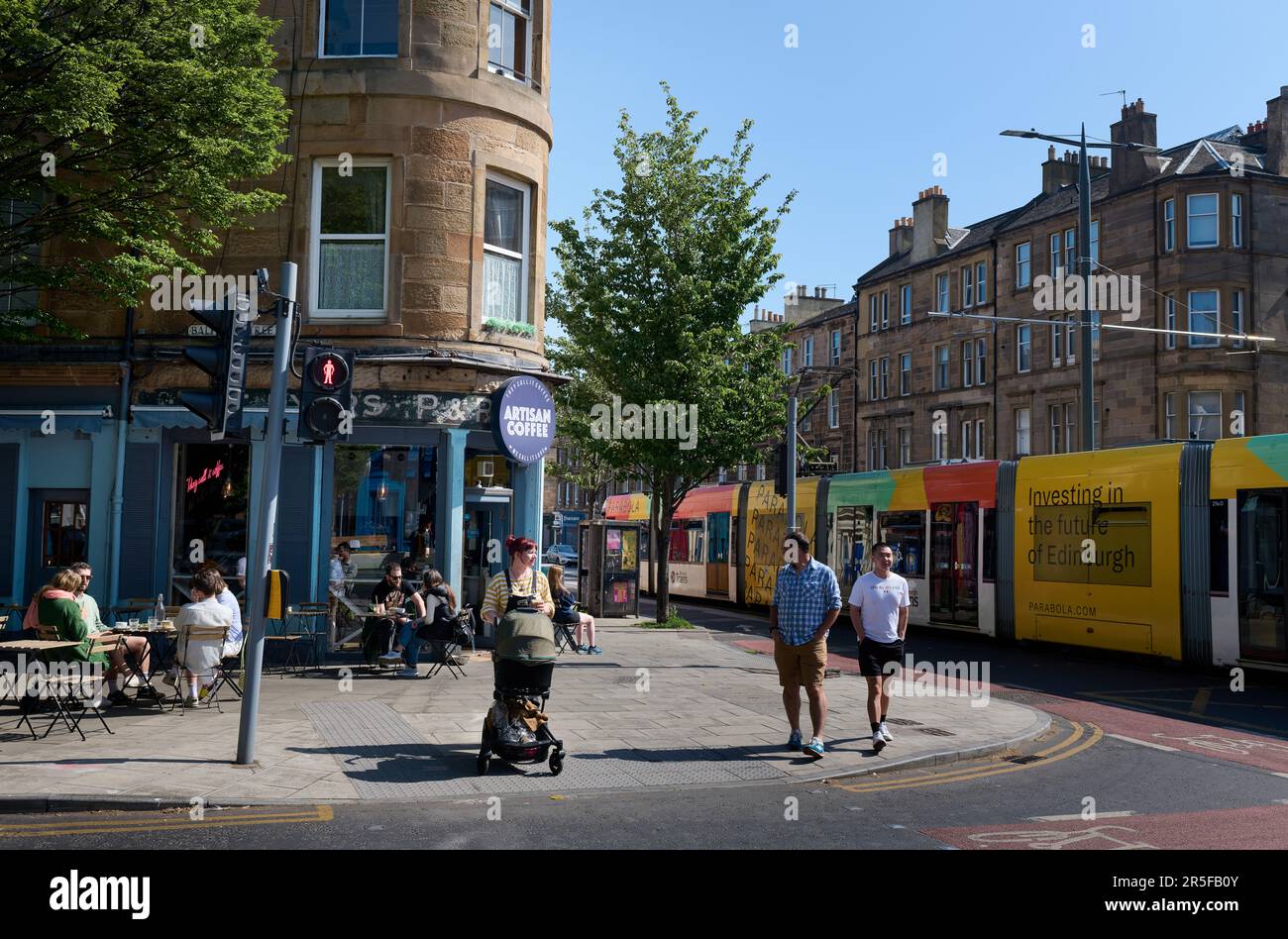 Edinburgh Scotland, UK 03 June 2023. People sit outside a cafe on Leith Walk by the Edinburgh ...
