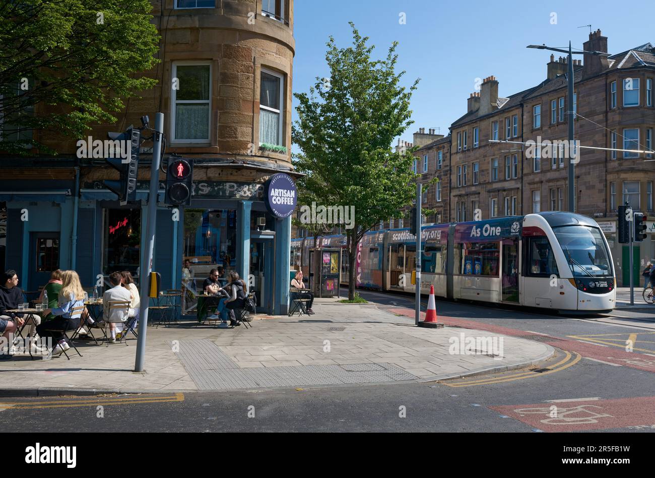 Edinburgh Scotland, UK 03 June 2023. People sit outside a cafe on Leith Walk by the Edinburgh ...
