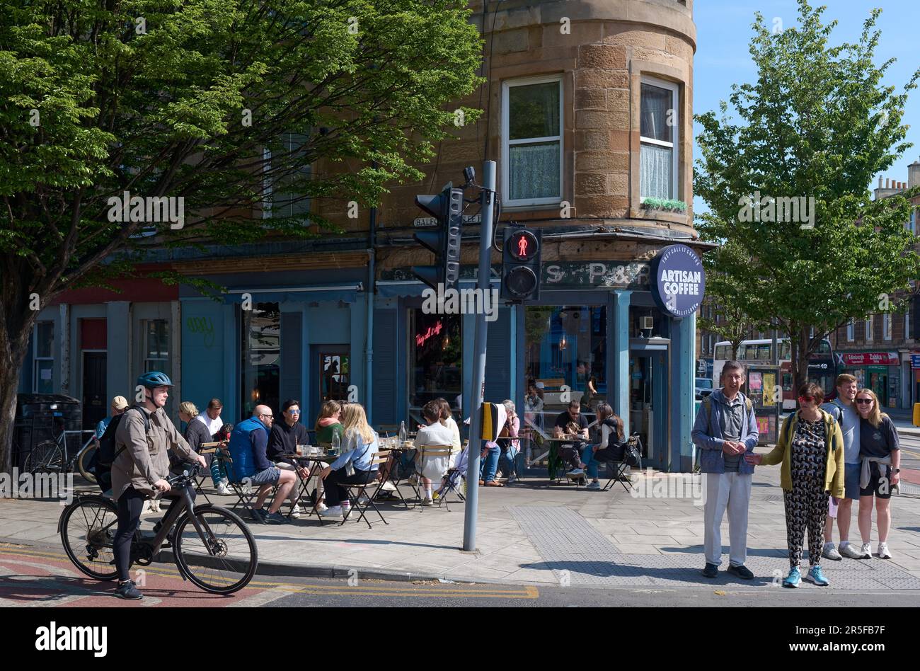 Edinburgh Scotland, UK 03 June 2023. People sit outside a cafe on Leith ...