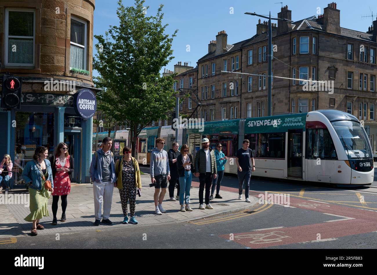 Edinburgh Scotland, UK 03 June 2023. People sit outside a cafe on Leith Walk by the Edinburgh ...