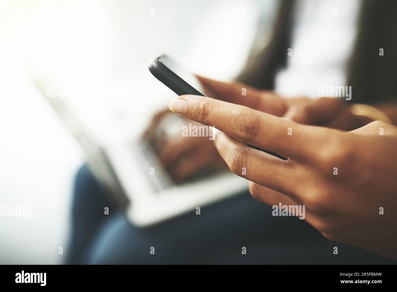 Smart tech is the secret to her success. a businesswoman using a ...