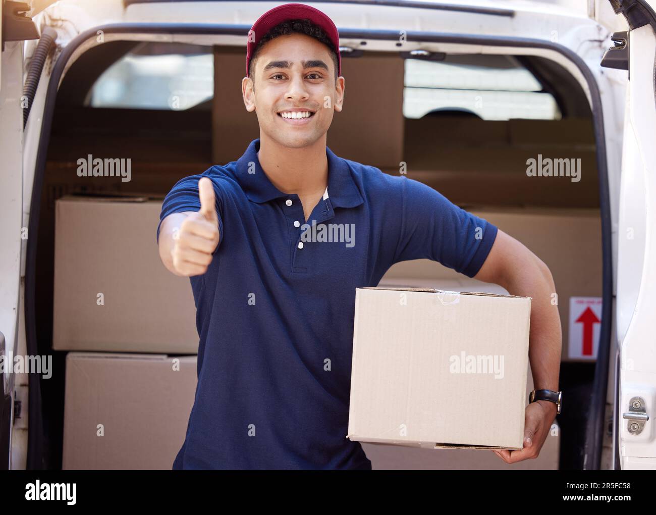 Delivery, thumbs up and portrait of man with box for shipping ...