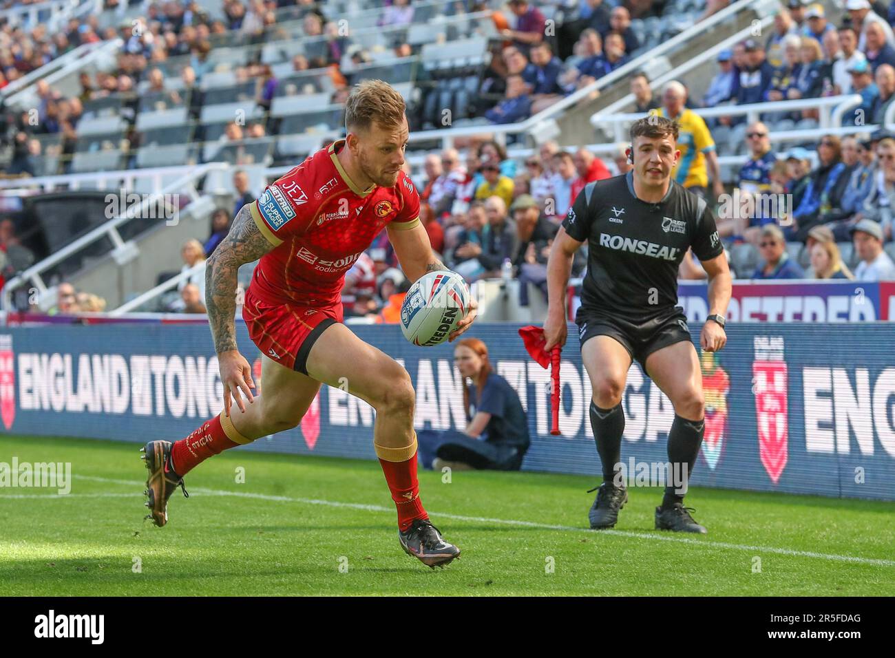 Mathieu Cozza #24 of Catalans Dragons makes a break for the try line ...