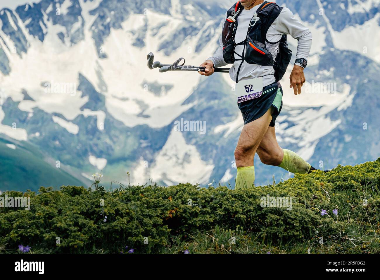 athlete runner running skyrunning trail race on green meadow in ...