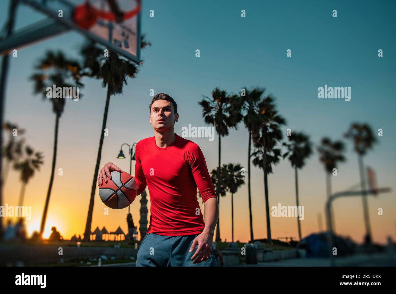 Basketball player training basketball on a court in Venice Beach Stock ...
