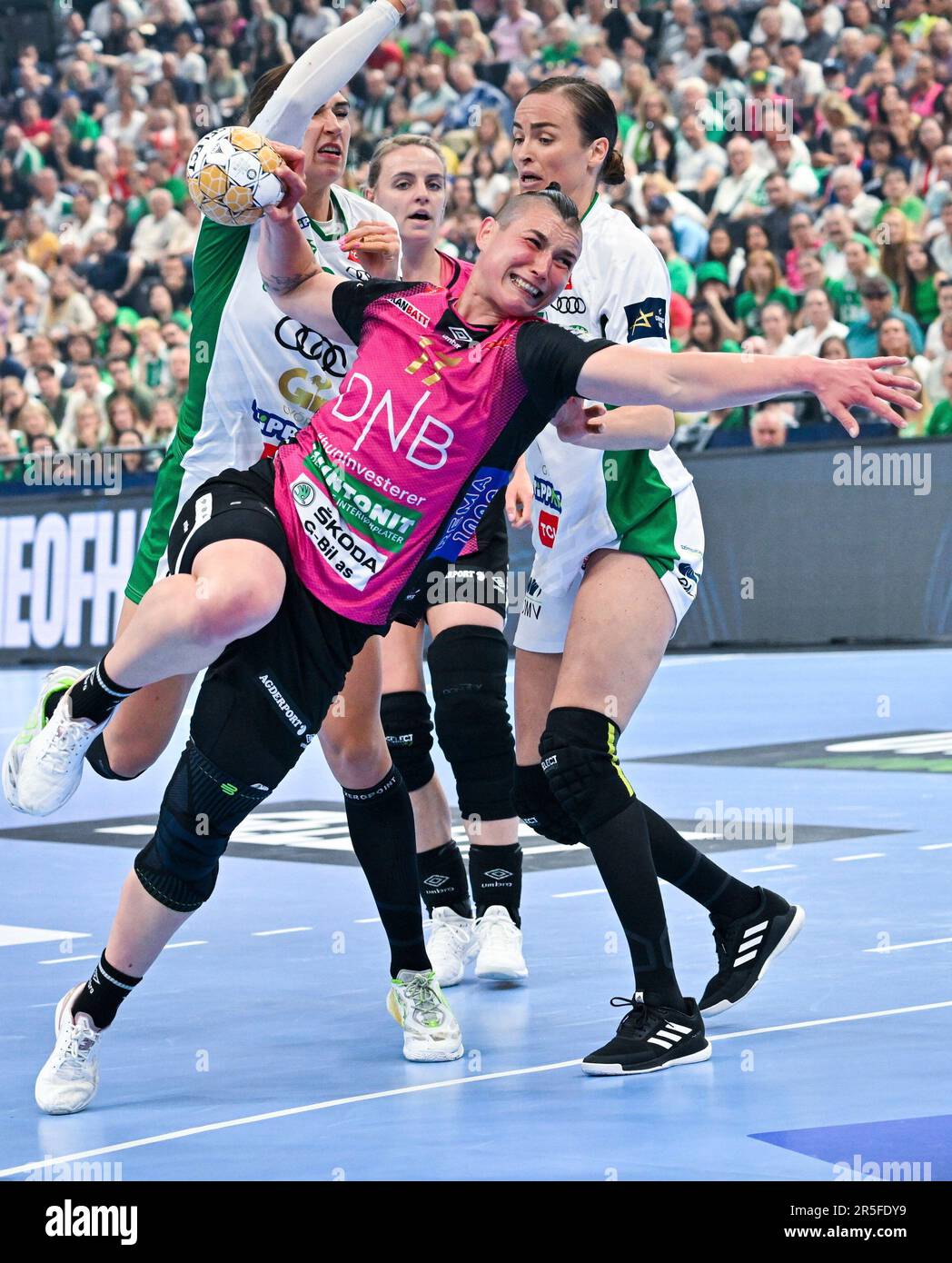 Katarina Jezic, center, of Vipers Kristiansand throws the ball next to Line Haugsted, left, and ...