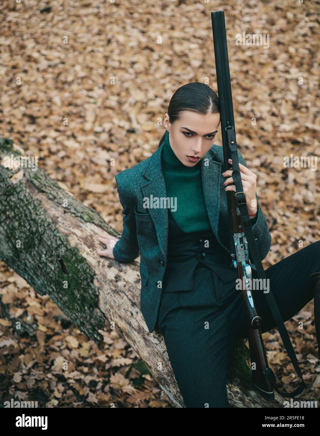 Female with a gun. Hunter woman. Hunter with a backpack and a hunting ...