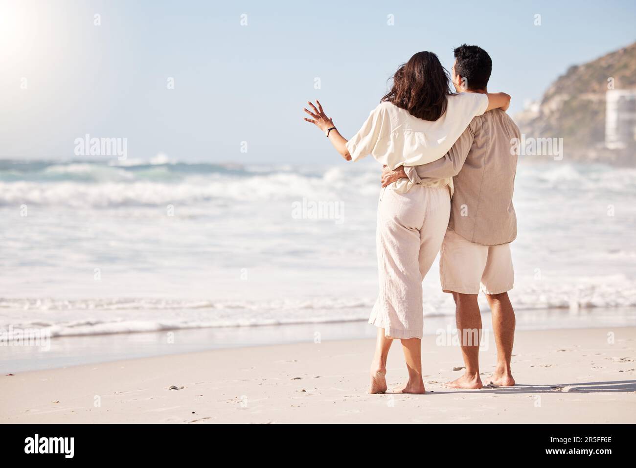 Couple hug on beach, sea and back view with trust, travel and vacation ...