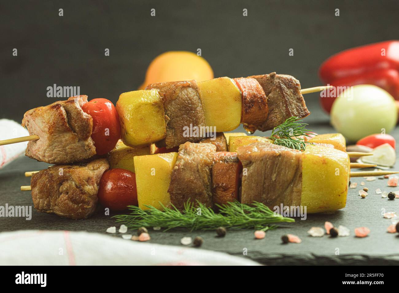 Fried meat with vegetables on an open fire, Food background with copy ...