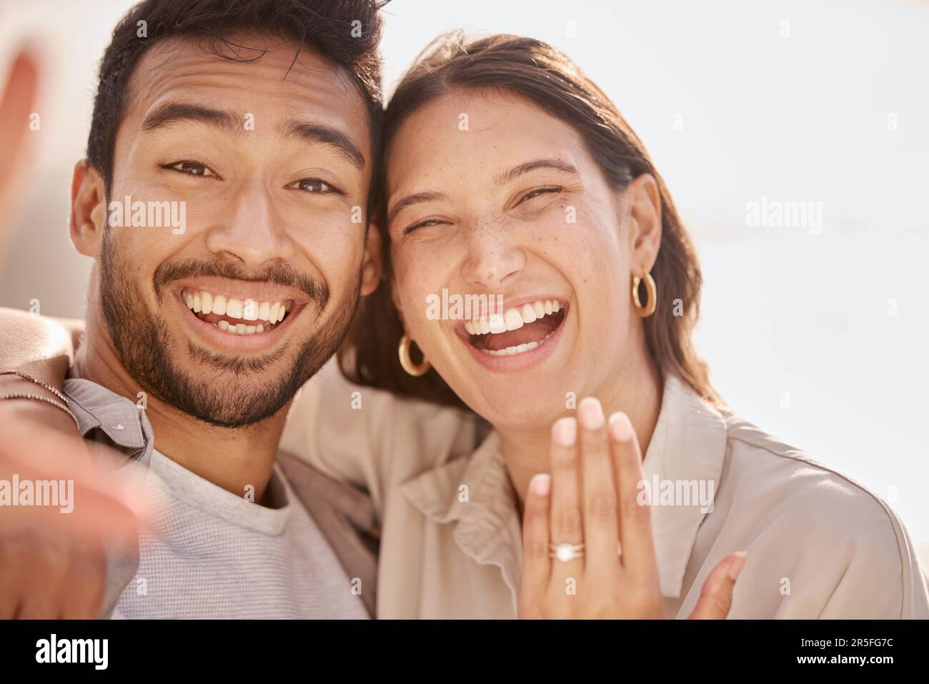 Couple in selfie, proposal and engagement ring with love and commitment ...