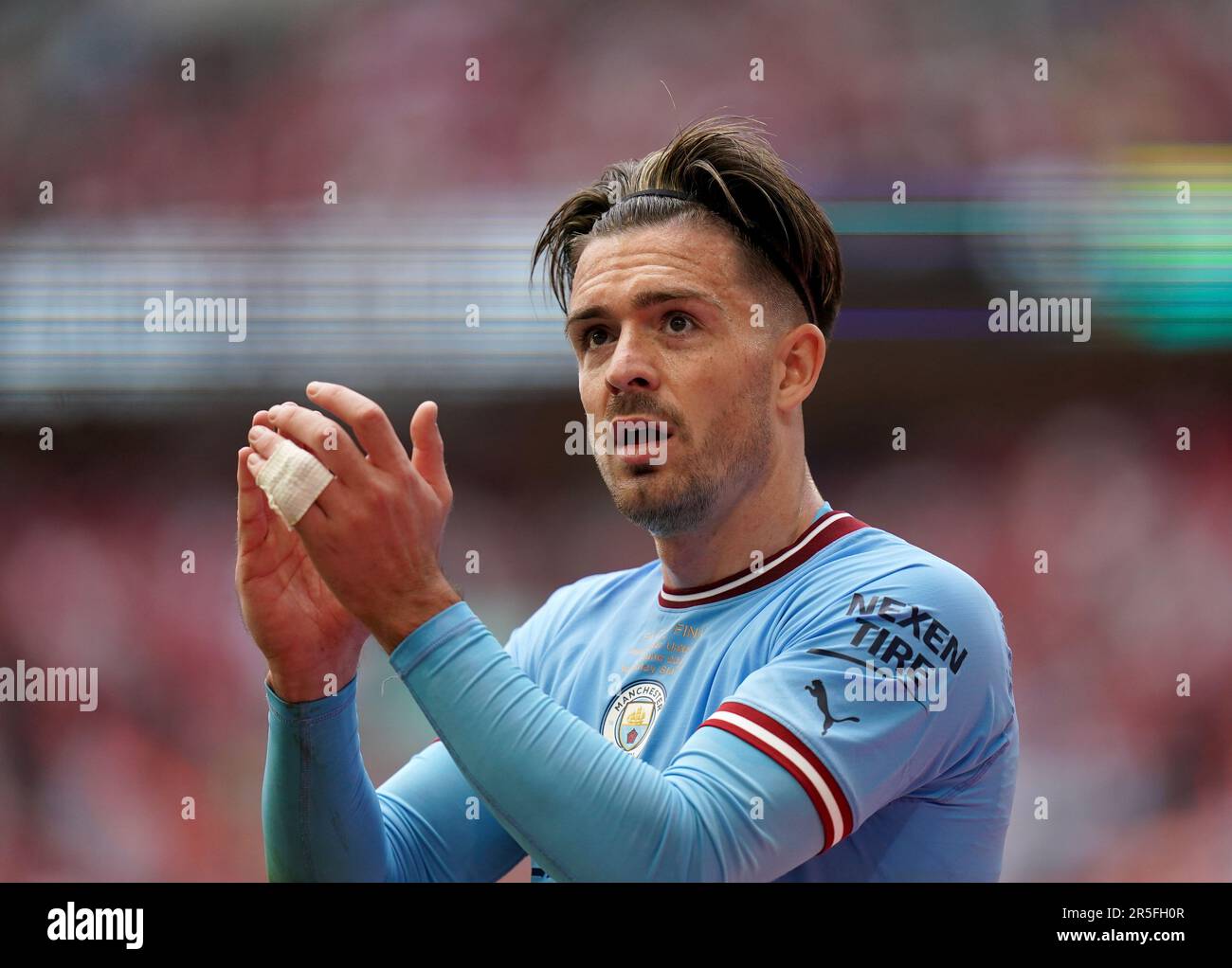 Manchester City's Jack Grealish applauds the fans after coming off as a ...