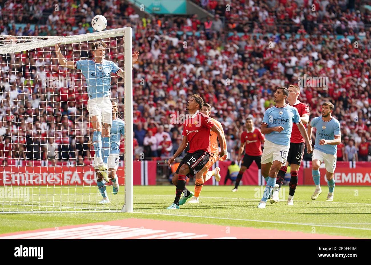 Manchester United's Scott McTominay (2nd right) looks on as his shot ...