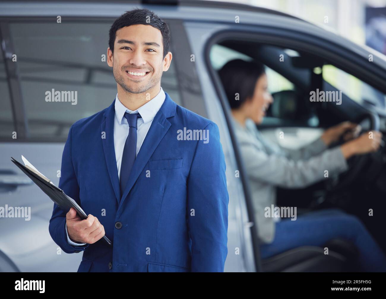 Documents, portrait and car salesman smile at showroom, workshop or ...