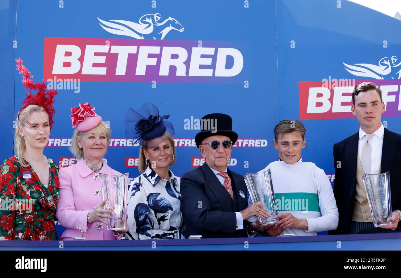 The winning connections celebrate after Torito won The Betfred Lester ...