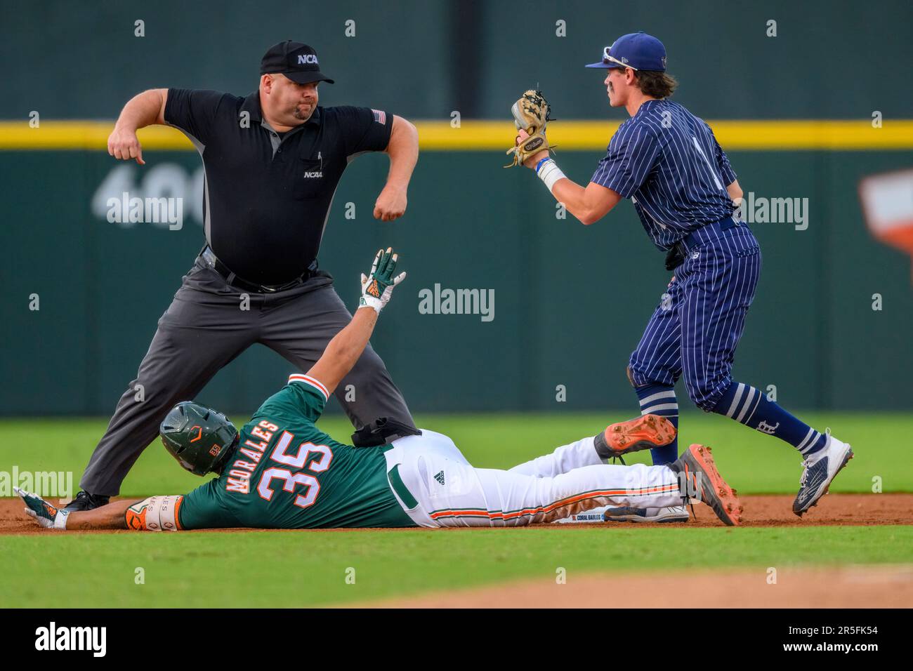 Miami infielder Yohandy Morales (35) is called out at second base after ...