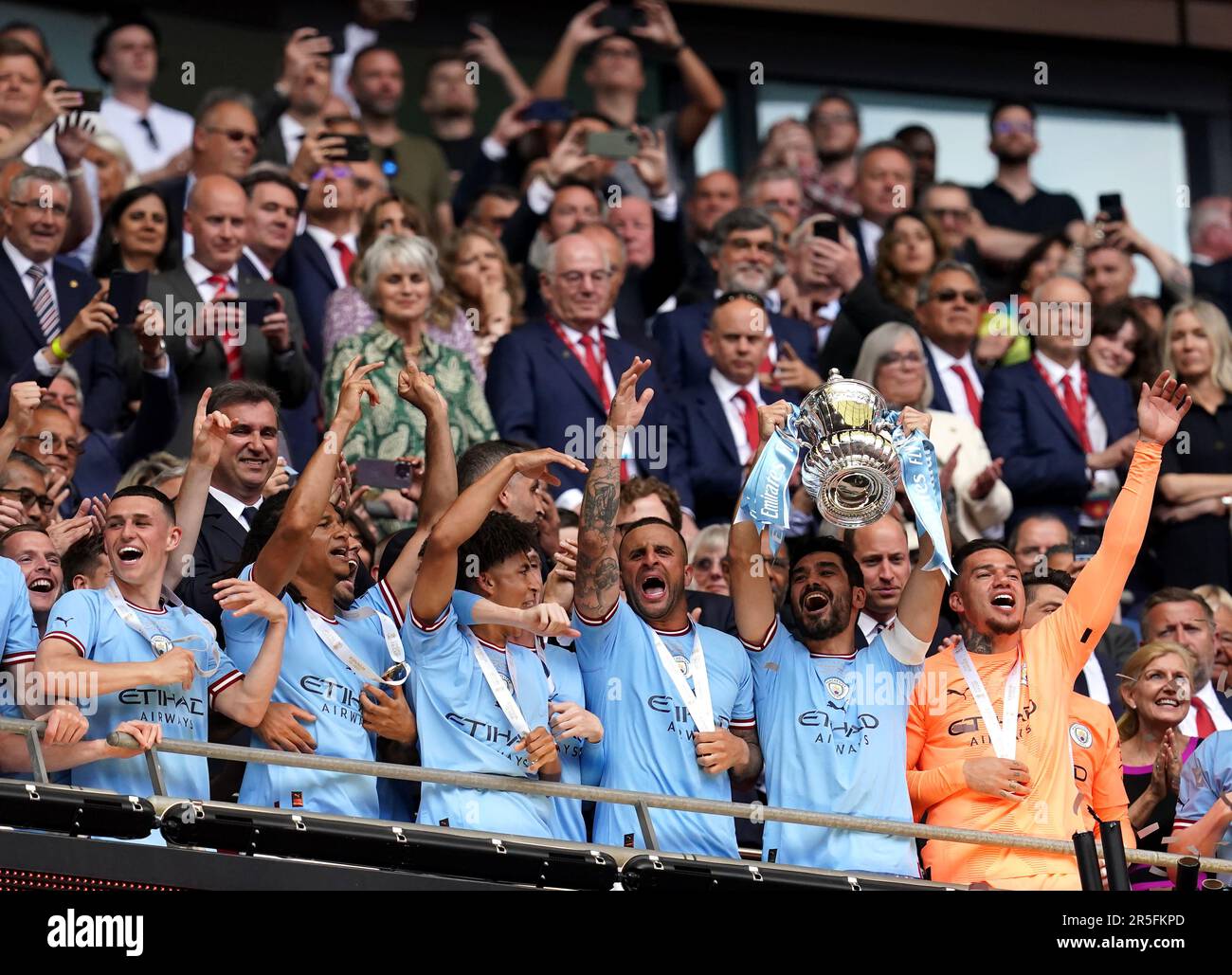 Manchester City's Ilkay Gundogan lifts the Emirates FA Cup trophy ...