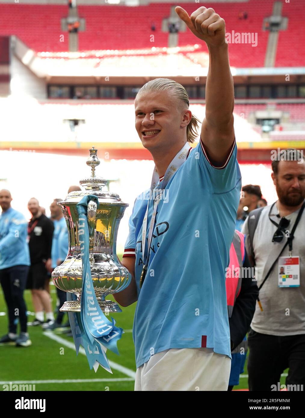 Manchester City's Erling Haaland celebrates with the Emirates FA Cup ...