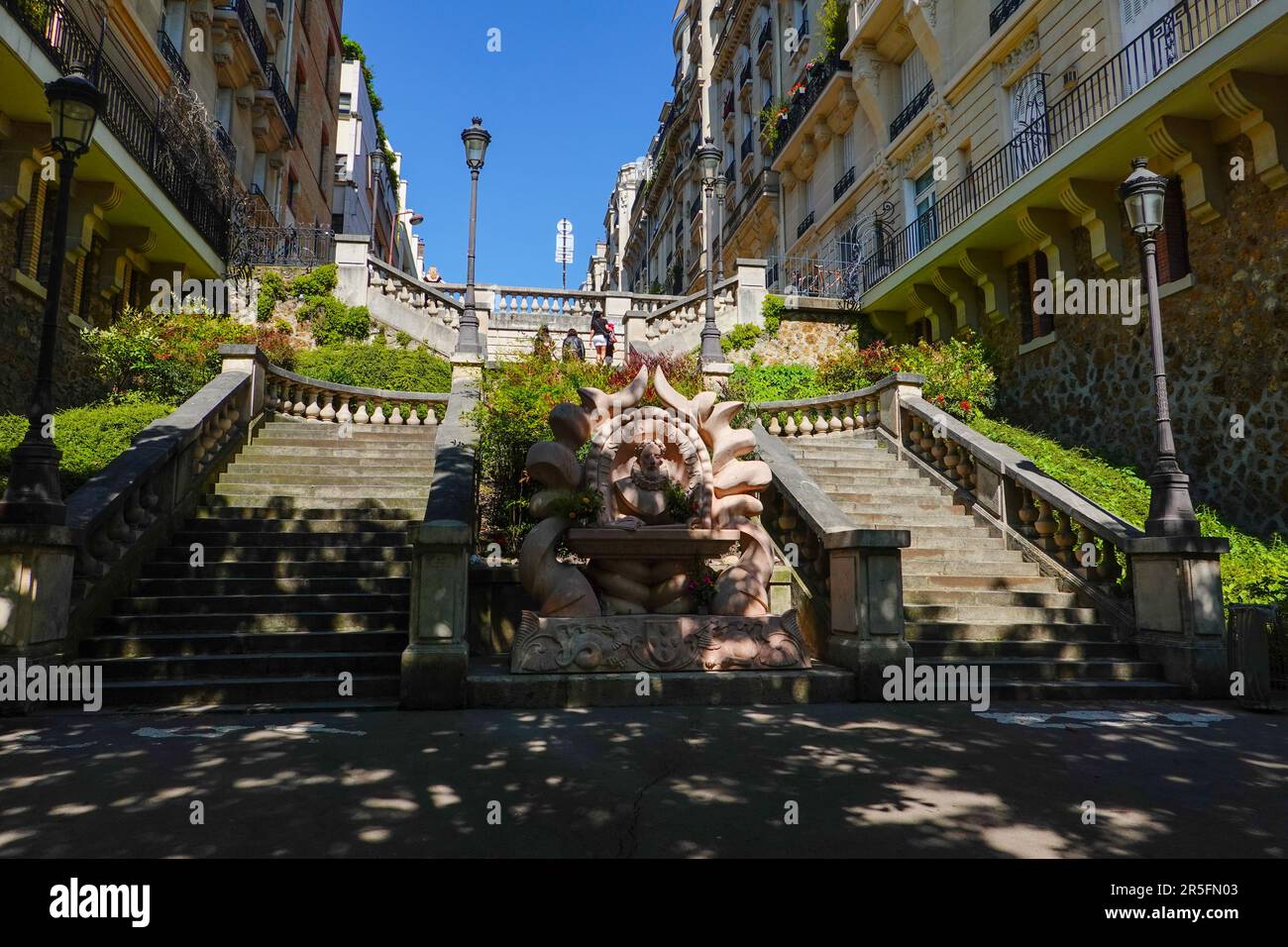 People climbing the Luis de Camoens stairs up from Boulevard Delessert ...