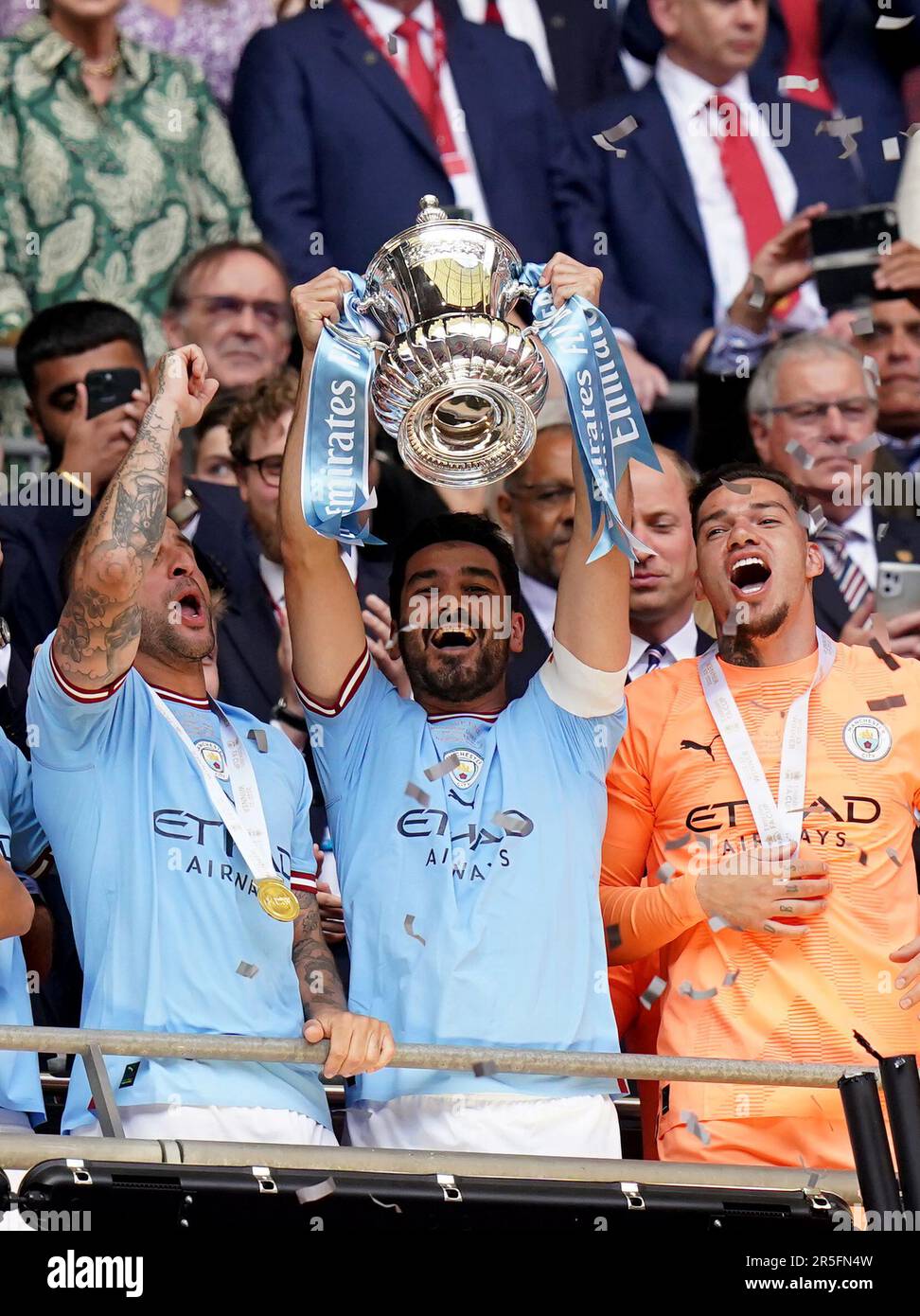 Manchester City's Ilkay Gundogan lifts the Emirates FA Cup trophy ...