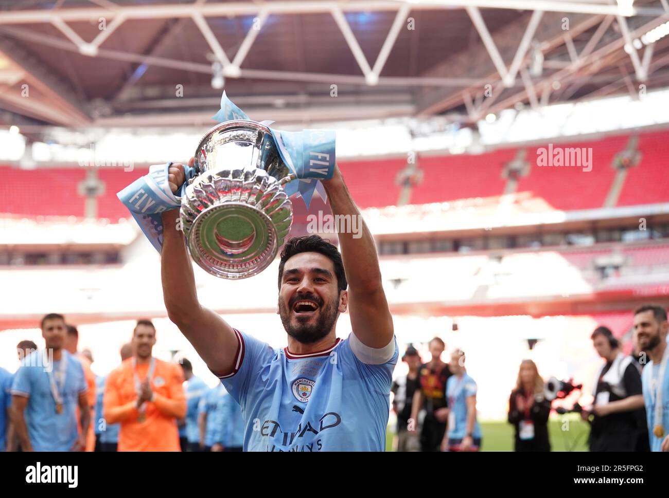 Manchester City's Ilkay Gundogan with the Emirates FA Cup trophy ...