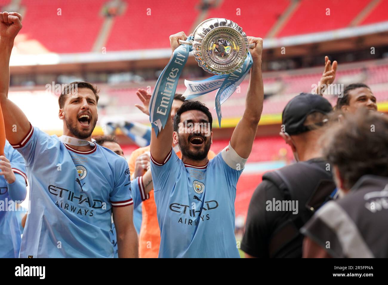 Manchester City's Ilkay Gundogan with the Emirates FA Cup trophy ...