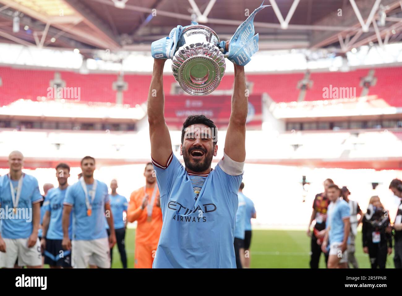 Manchester City's Ilkay Gundogan with the Emirates FA Cup trophy ...