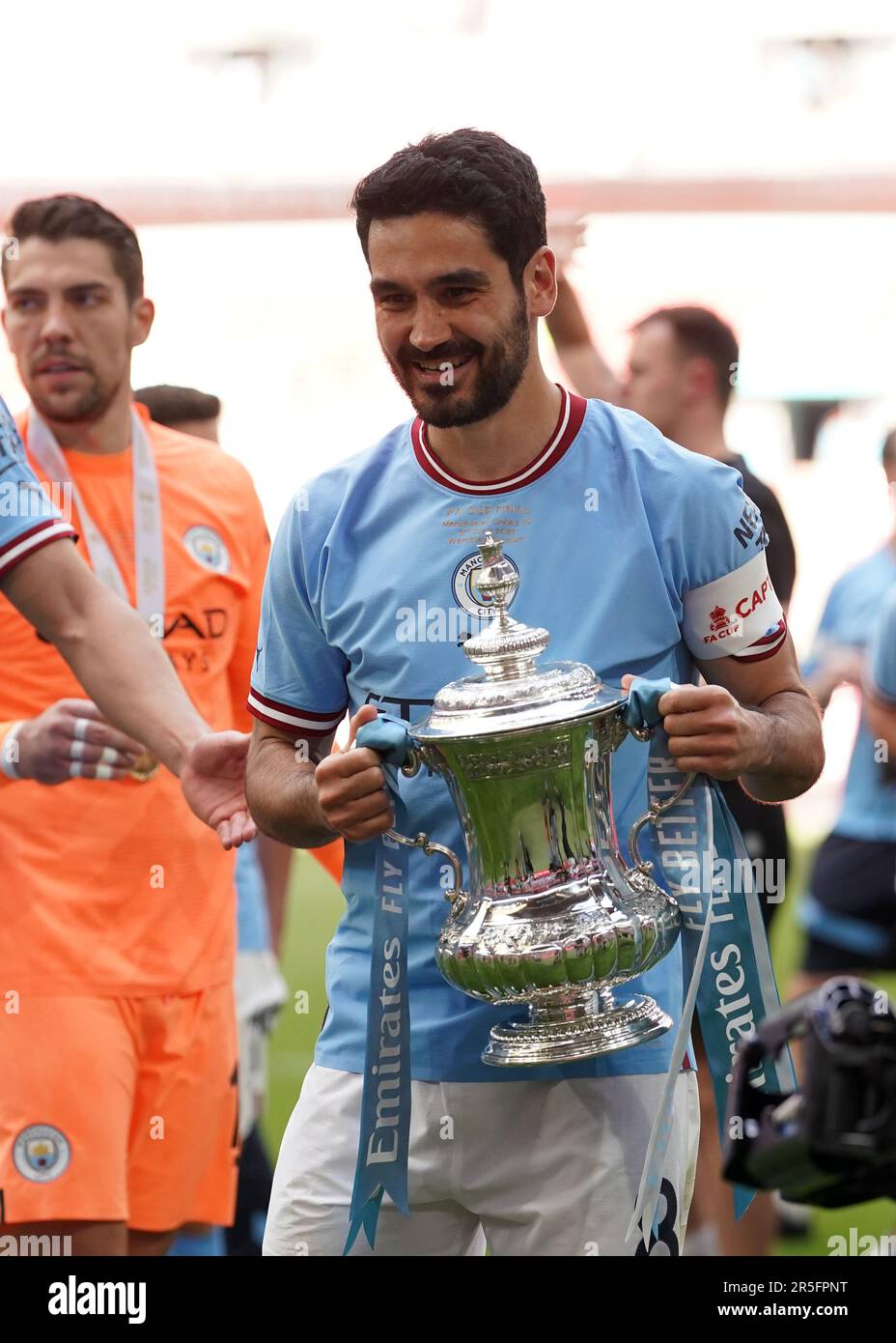 Manchester City's Ilkay Gundogan with the Emirates FA Cup trophy ...