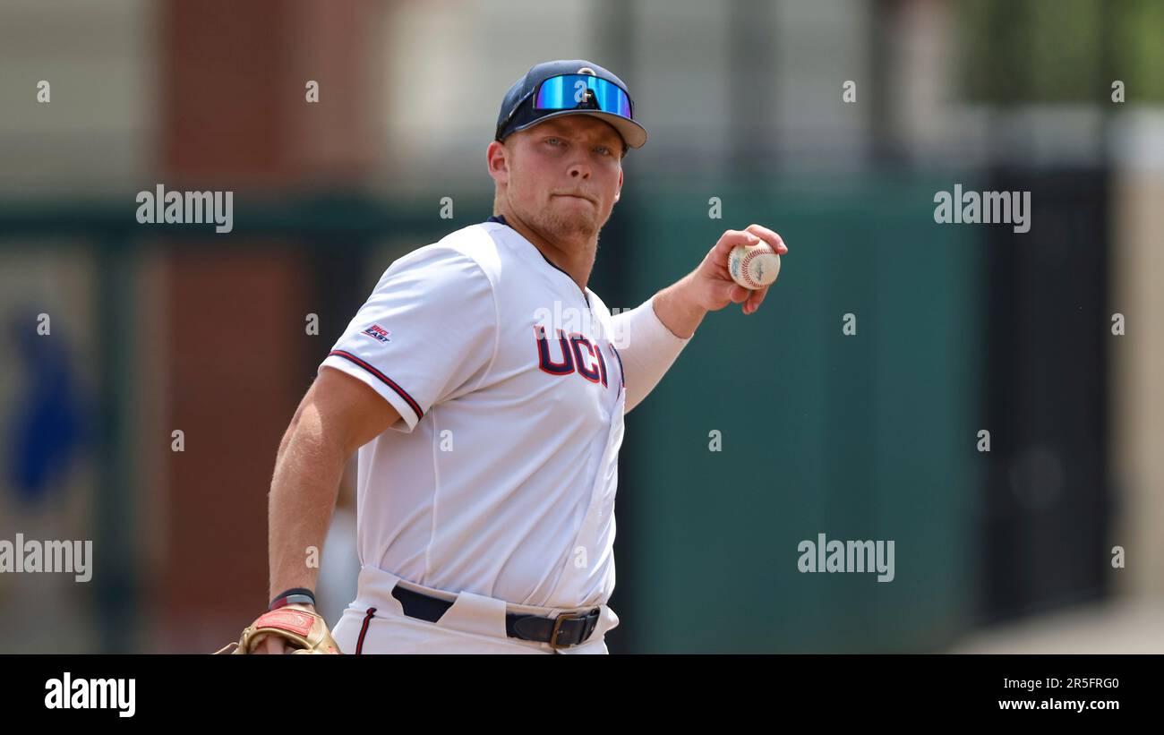 UConn first baseman Ben Huber (44) warms up before an NCAA baseball ...