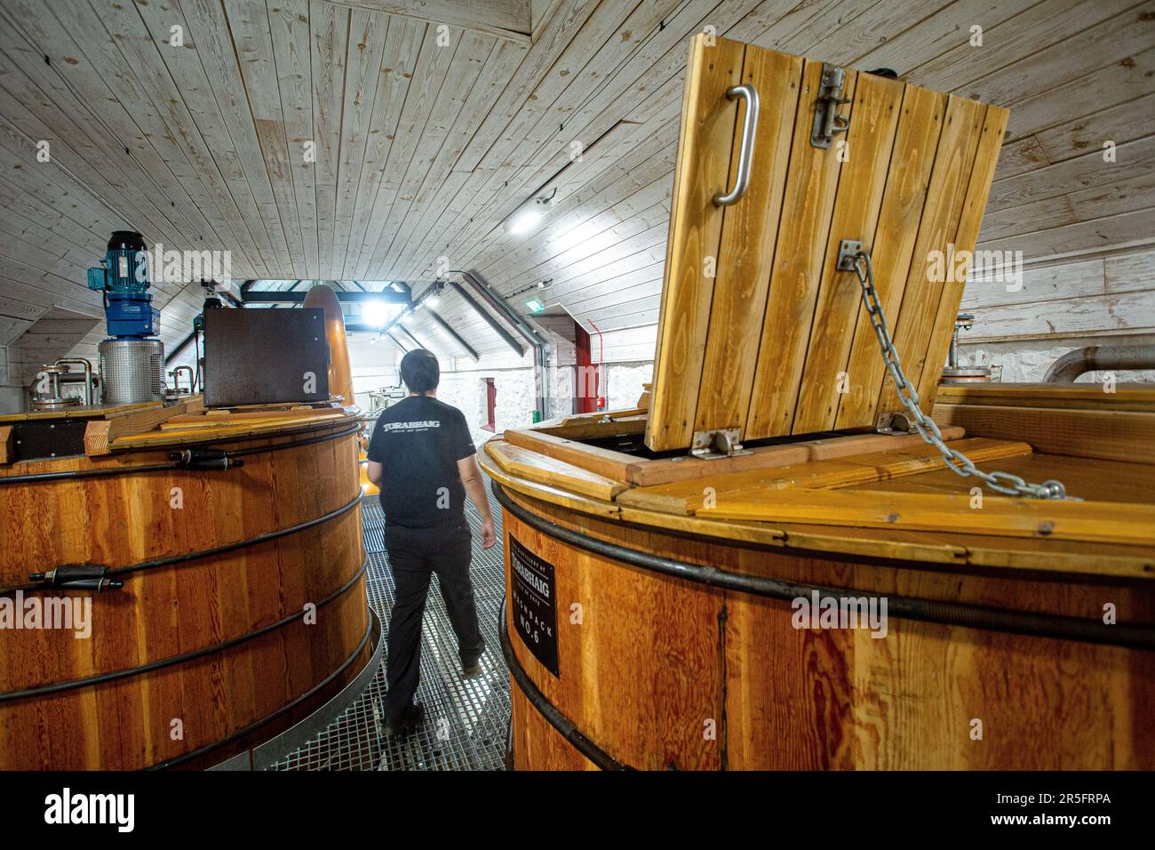 Distillery operator checks washback tank inside the Torabhaig ...