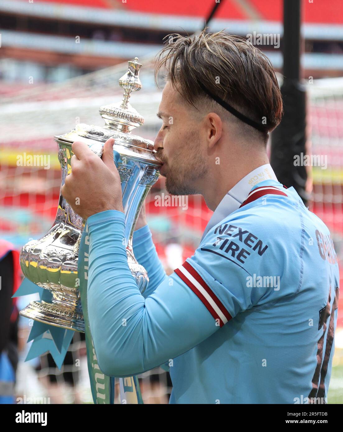 London, UK. 03rd June, 2023. Jack Grealish (MC) kisses the FA Cup at ...