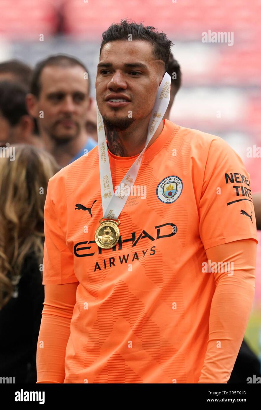 Manchester City goalkeeper Ederson with his winner's medal following ...