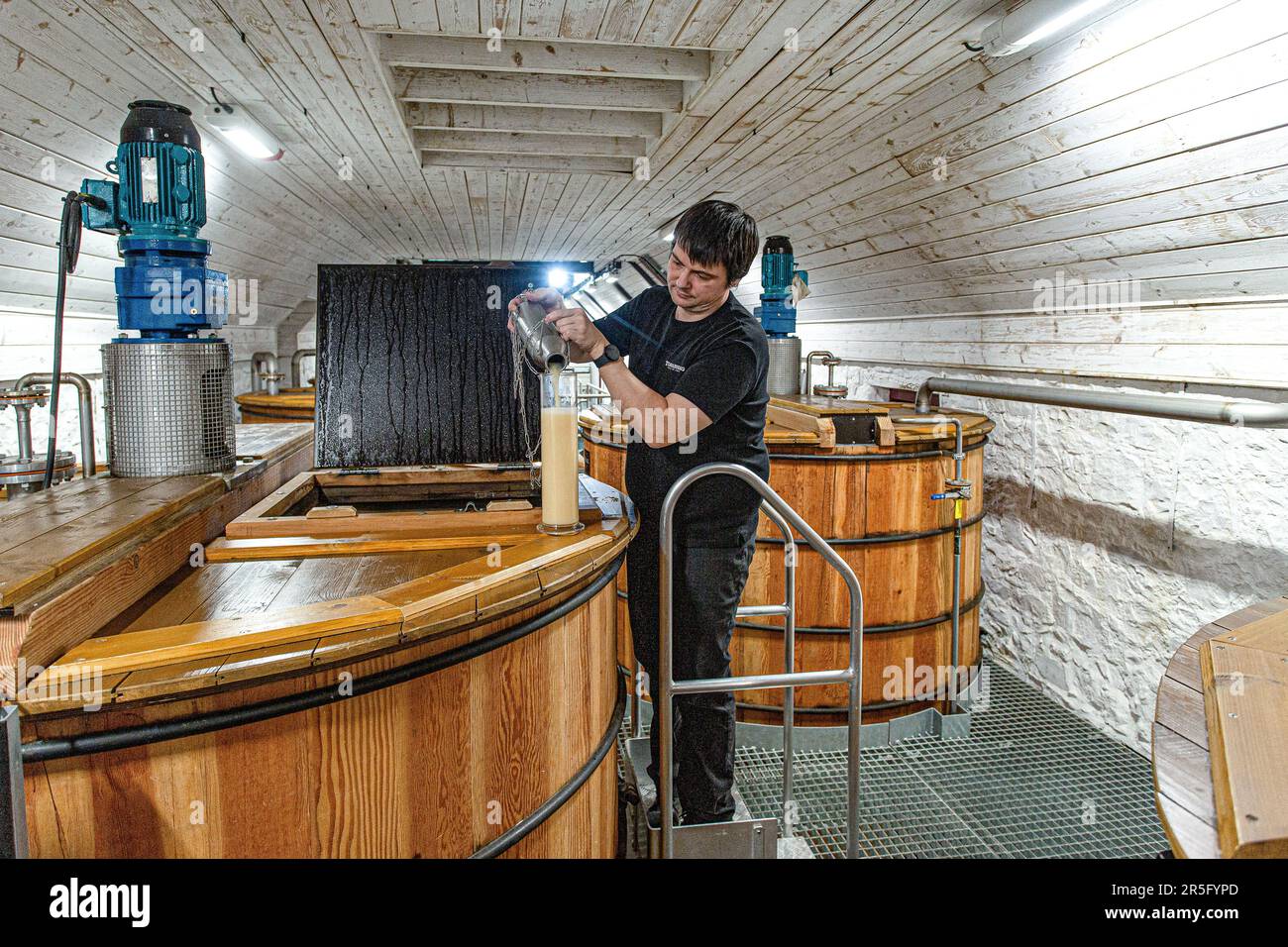 Distillery operator checks washback tank inside the Torabhaig ...