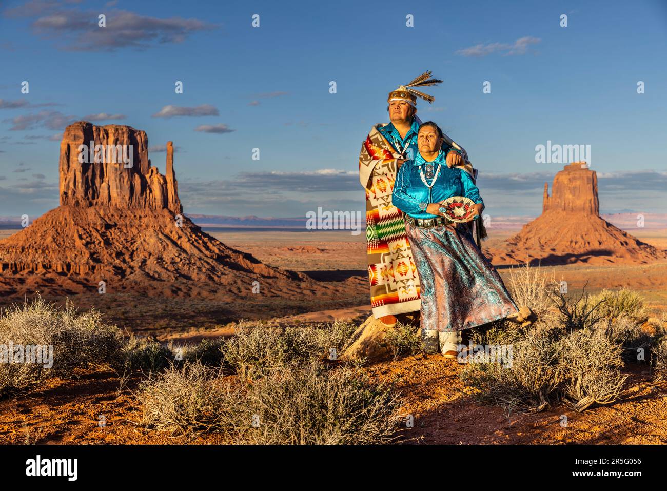 American Indian Navajo couple posing during sunset at Monument Valley ...