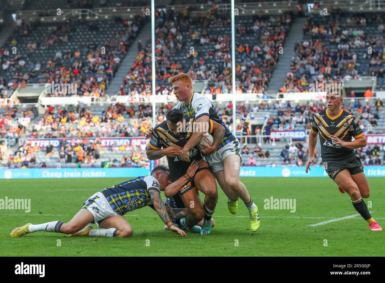 Kenny Edwards #11 of Castleford Tigers is tackled during the Betfred Super League Magic Weekend ...