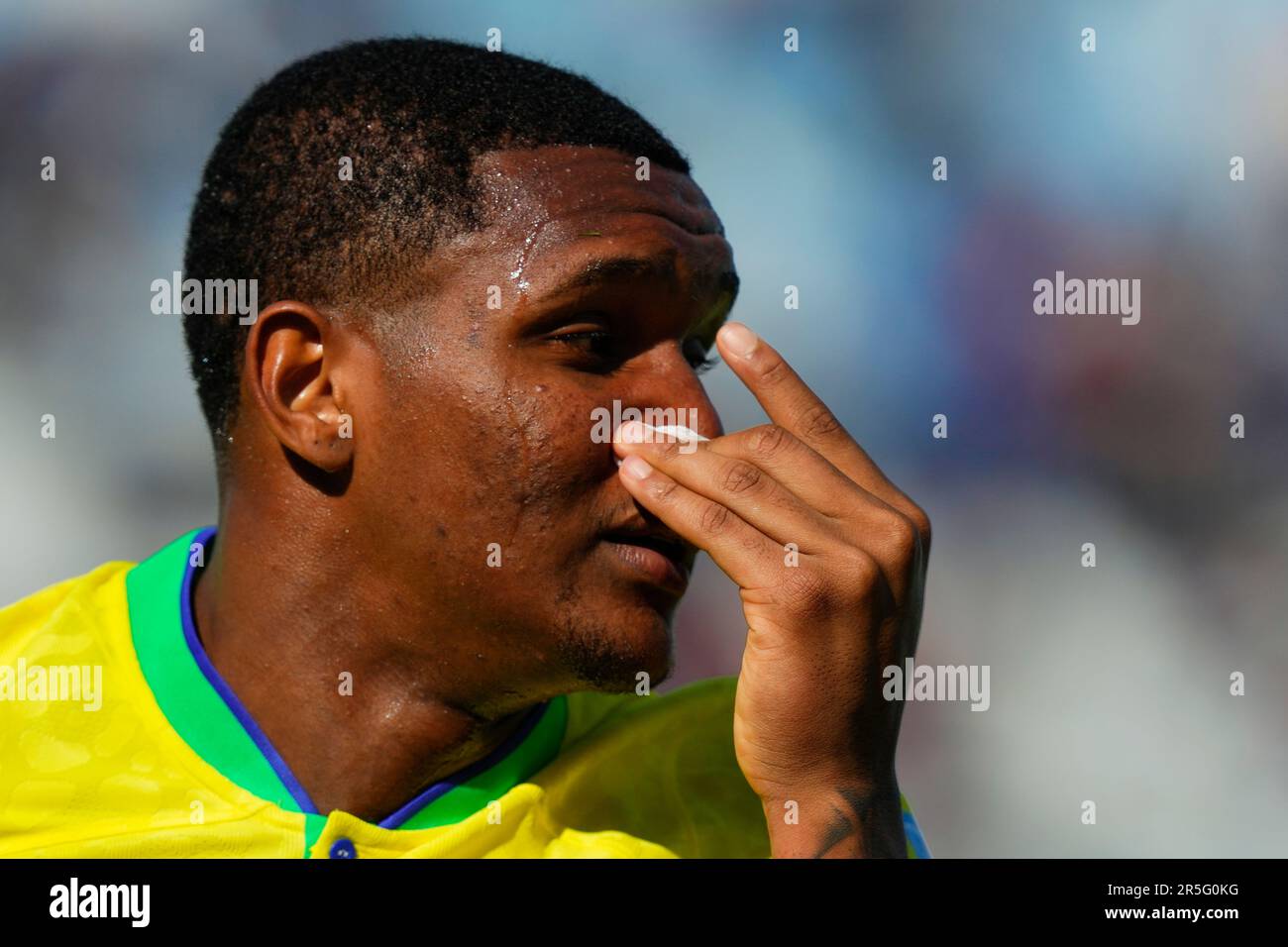 Brazil's Douglas Mendes tries to stop his nose from bleeding during a ...