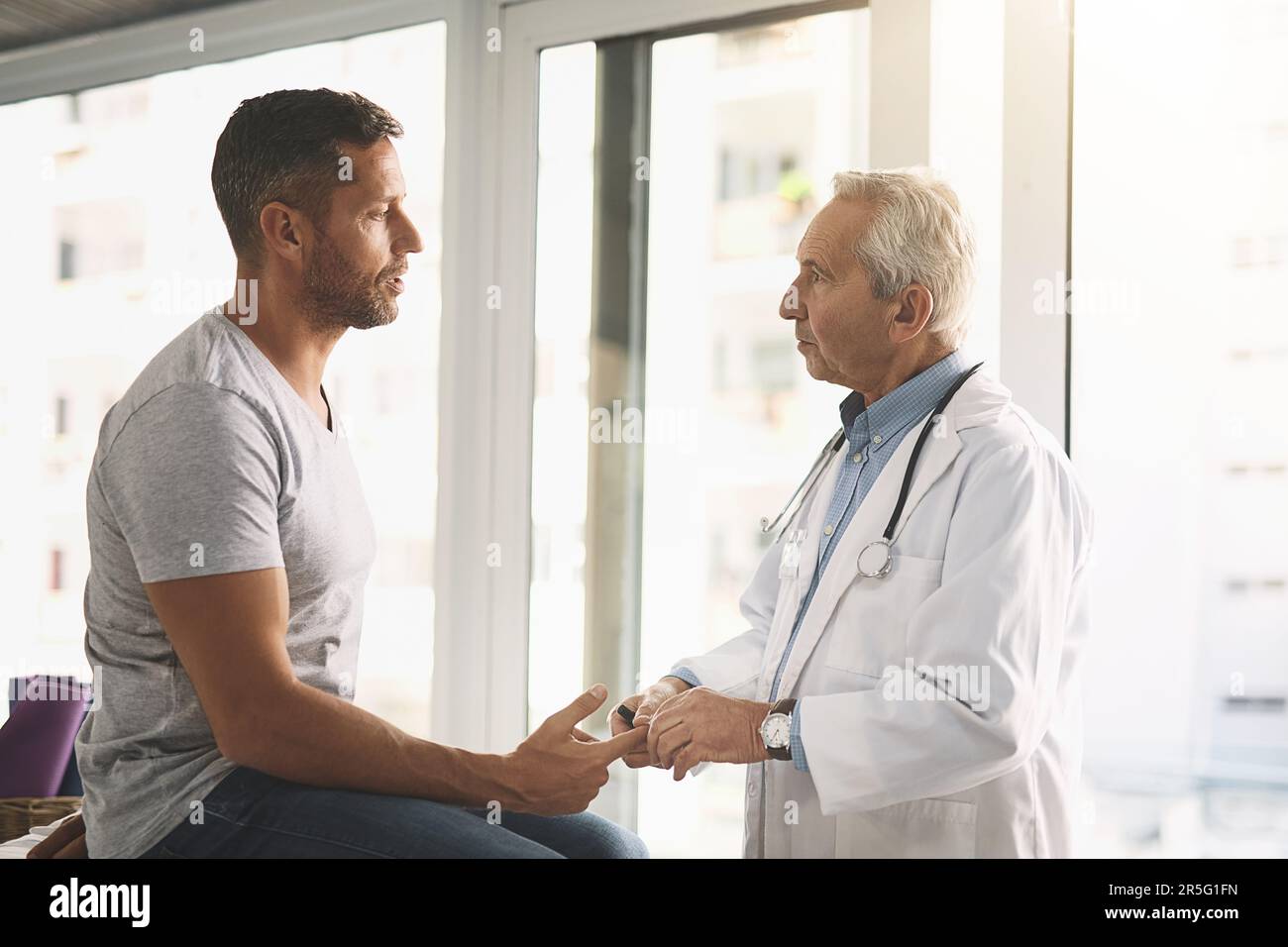 Doctor giving blood test finger hi-res stock photography and images - Alamy
