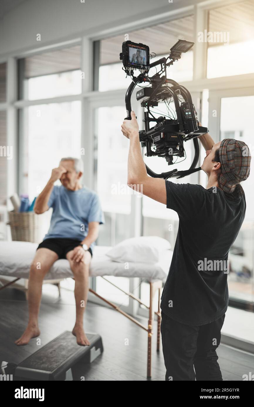 Raising high for those high angle shots. Behind the scenes shot of a ...