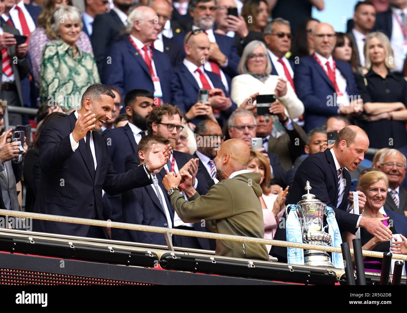 Khaldoon Al Mubarak greets Manchester City manager Pep Guardiola ...