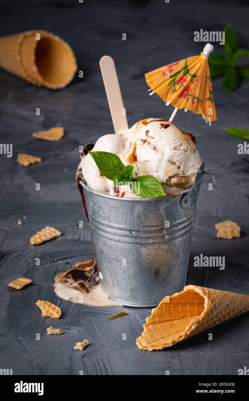 Vanilla ice cream with syrup in a metal bucket Stock Photo - Alamy