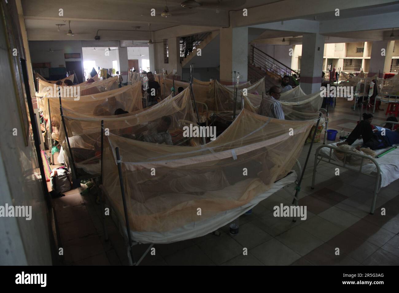 Dengue fever patients lying on the floor and on the bed outside the ...
