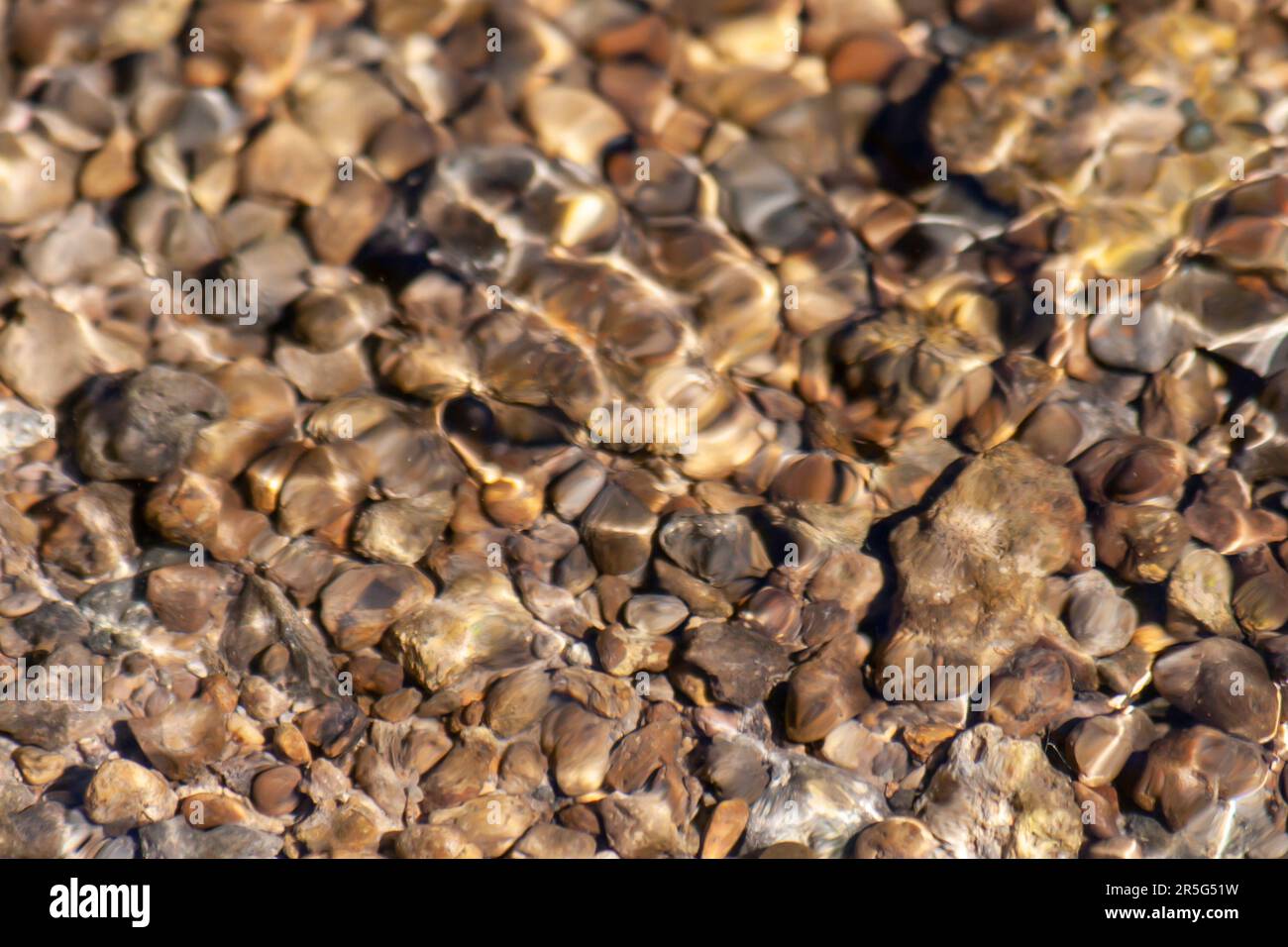 Slow running River over Rocks Stock Photo - Alamy