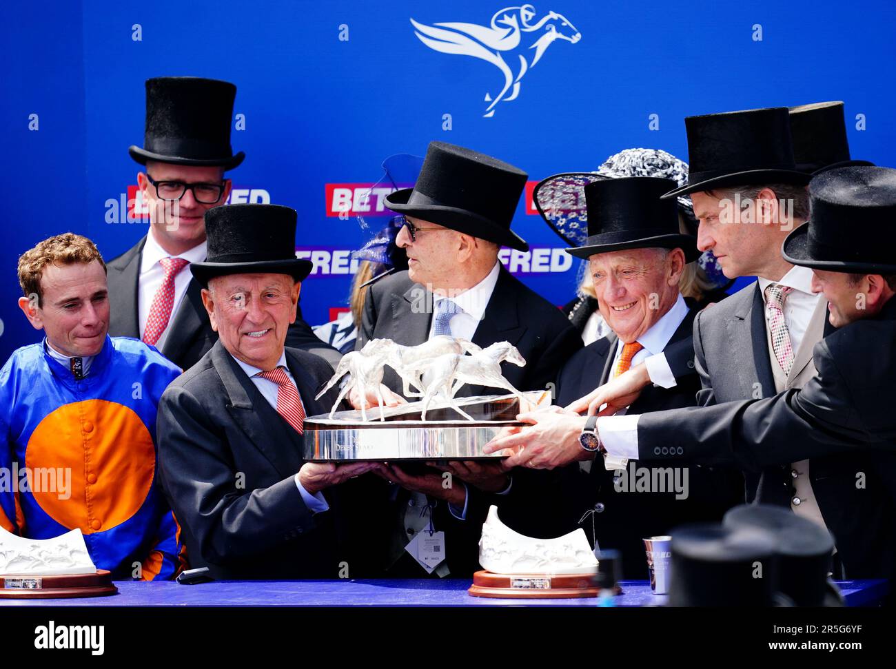 Ryan Moore and connections celebrate winning the Betfred Derby with ...