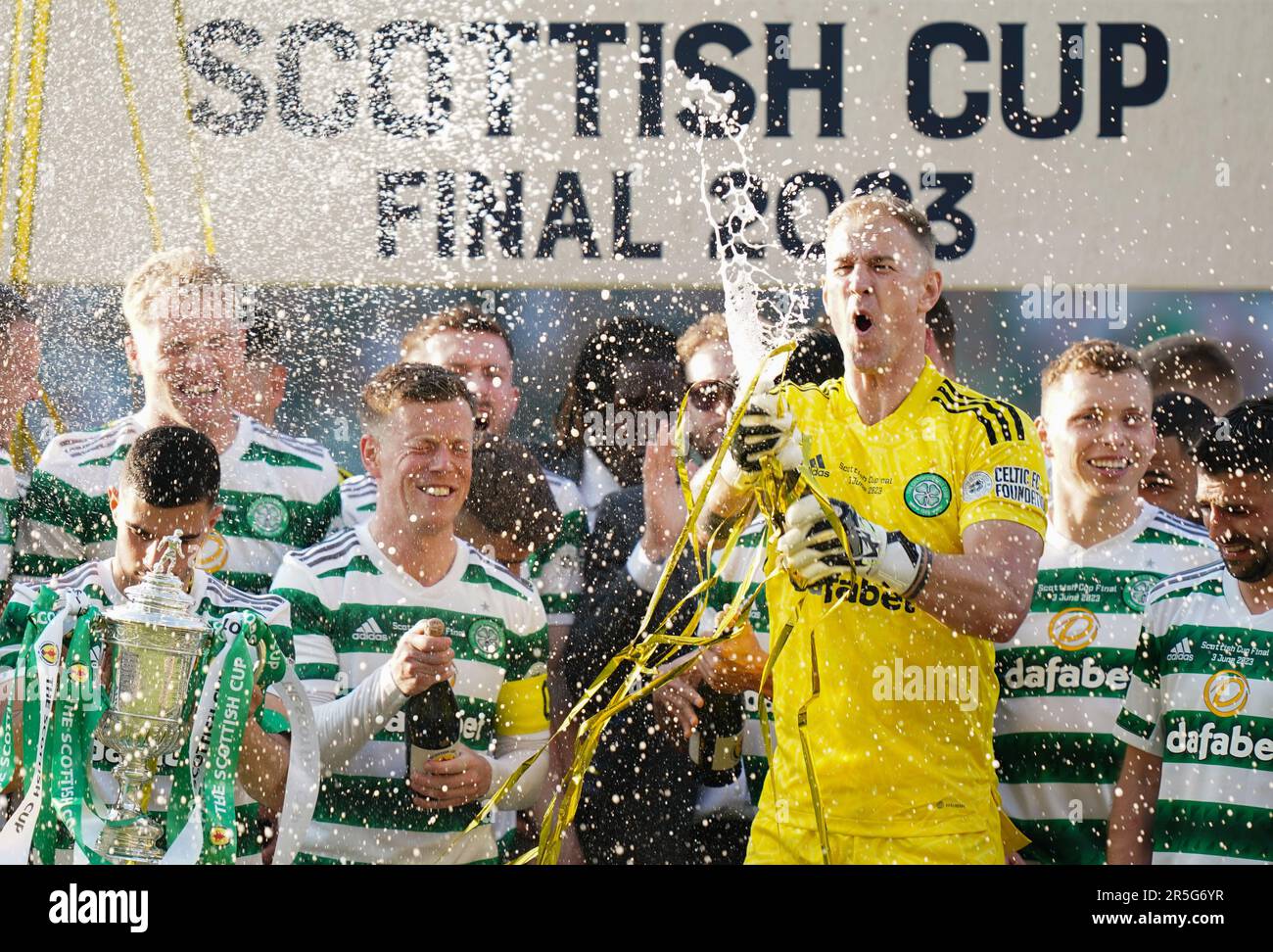 The Celtic players celebrate with the Scottish Cup after winning the ...