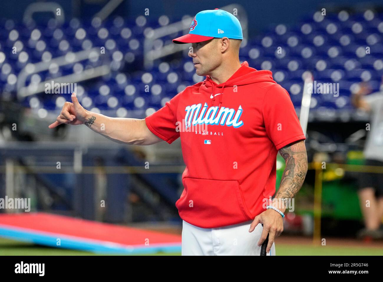 Miami Marlins manager Skip Schumaker stands on the filed before a ...