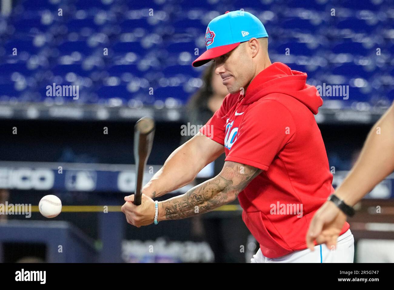 Miami Marlins manager Skip Schumaker takes batting practice before a ...