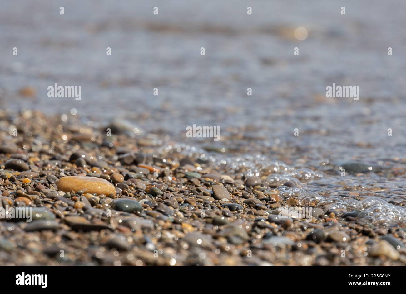 Pebbles on beach lake hi-res stock photography and images - Alamy