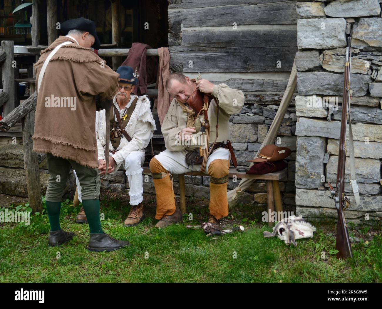 Historical reenactors prepare to participate in a living history ...