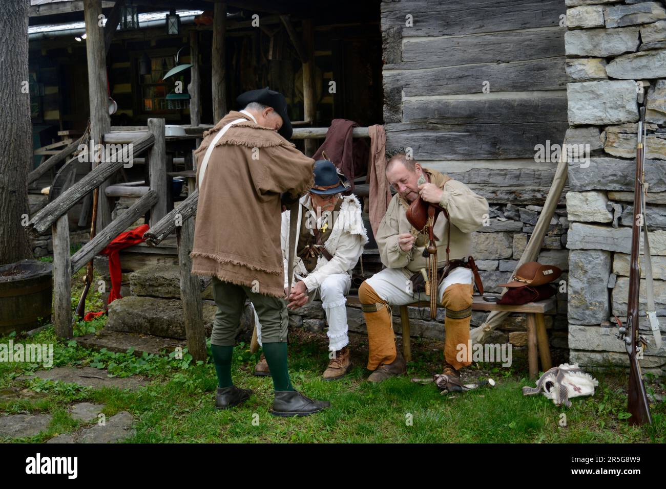 Historical reenactors prepare to participate in a living history ...